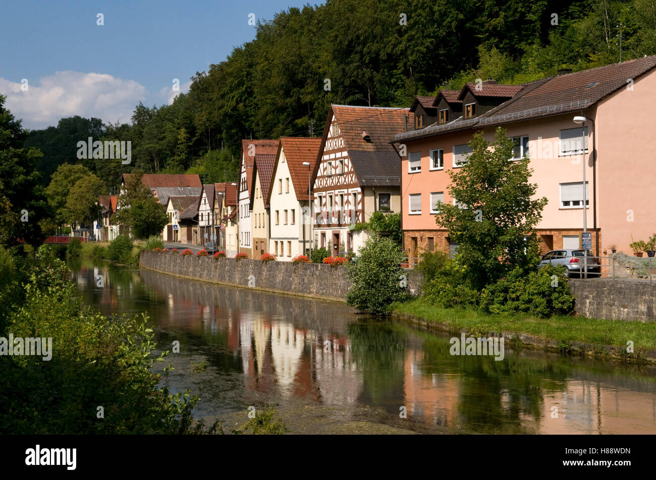 Houses reflected in the Wiesent River, Waischenfeld, Wiesenttal ...
