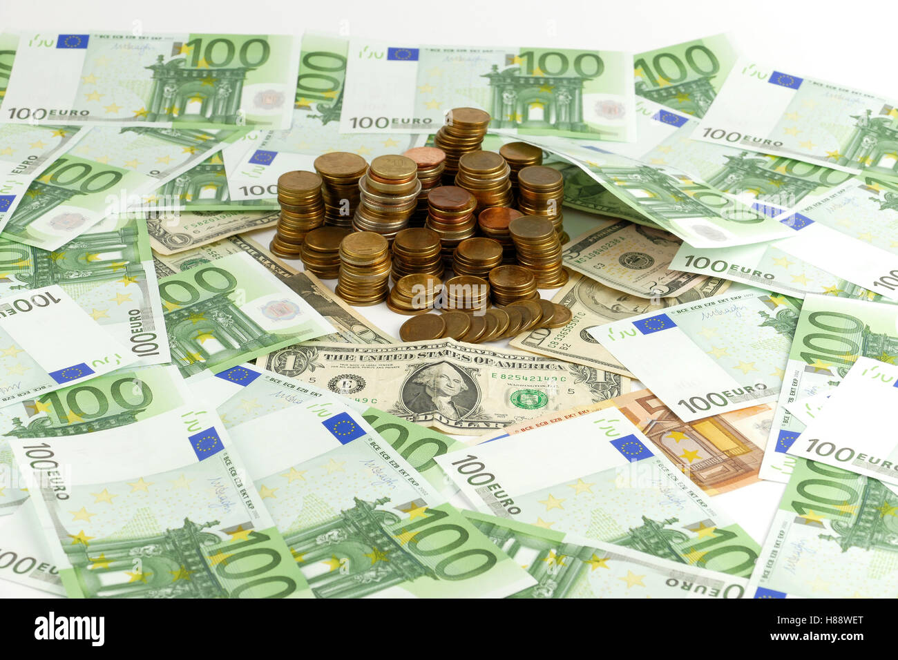 Banknotes and coins isolated on white background Stock Photo - Alamy