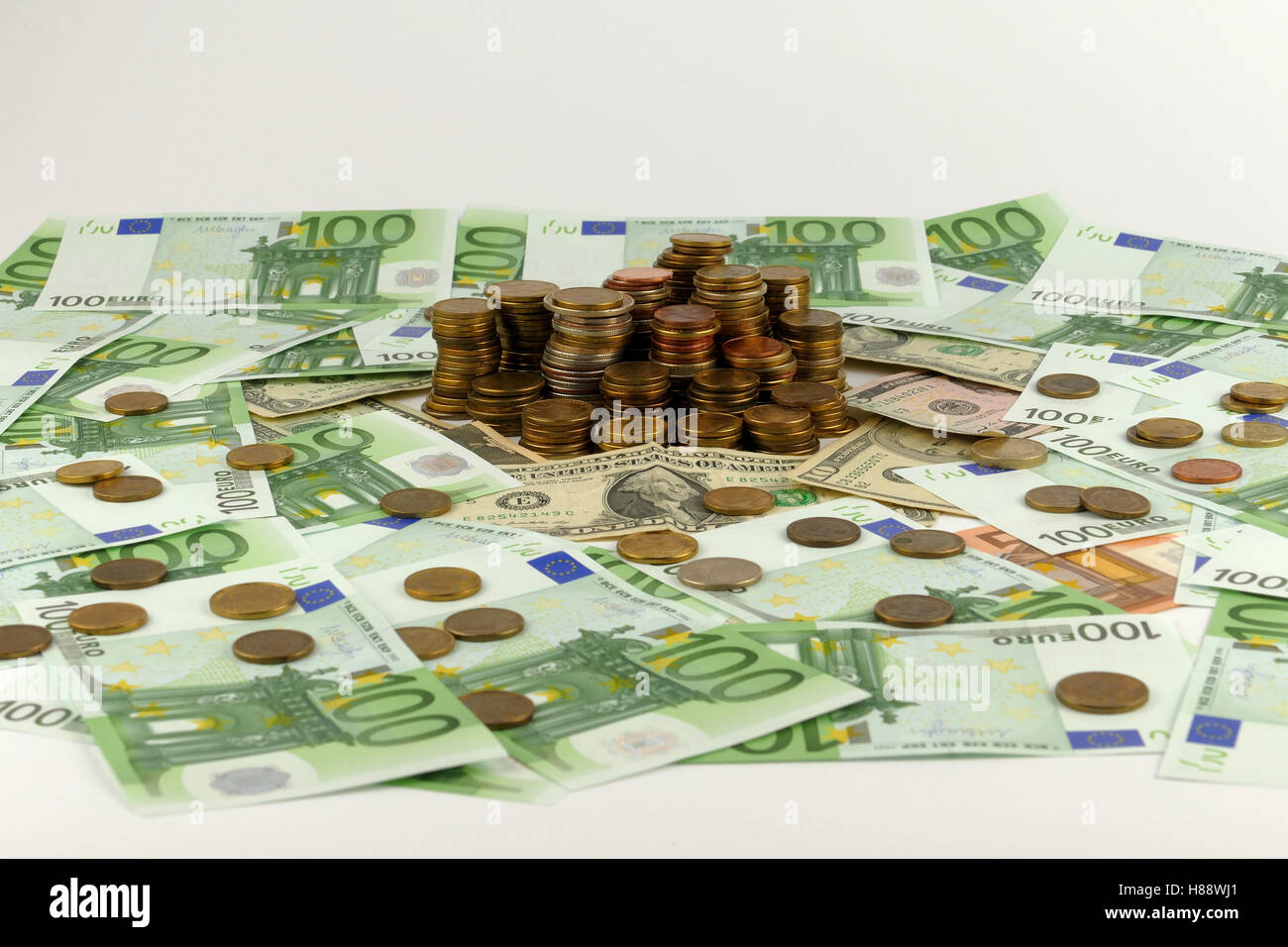 Banknotes and coins isolated on white background Stock Photo - Alamy