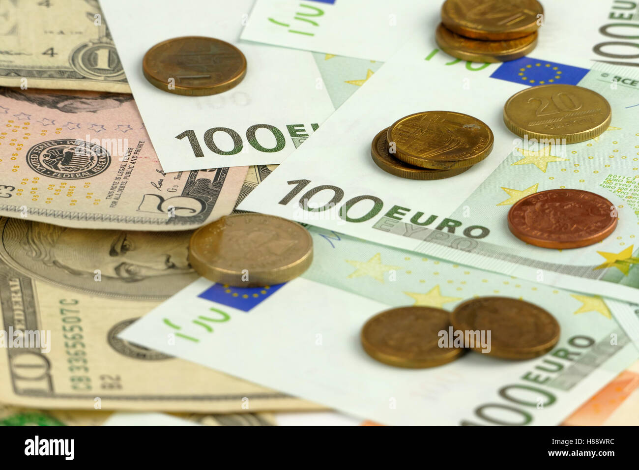 Banknotes and coins isolated on white background Stock Photo - Alamy