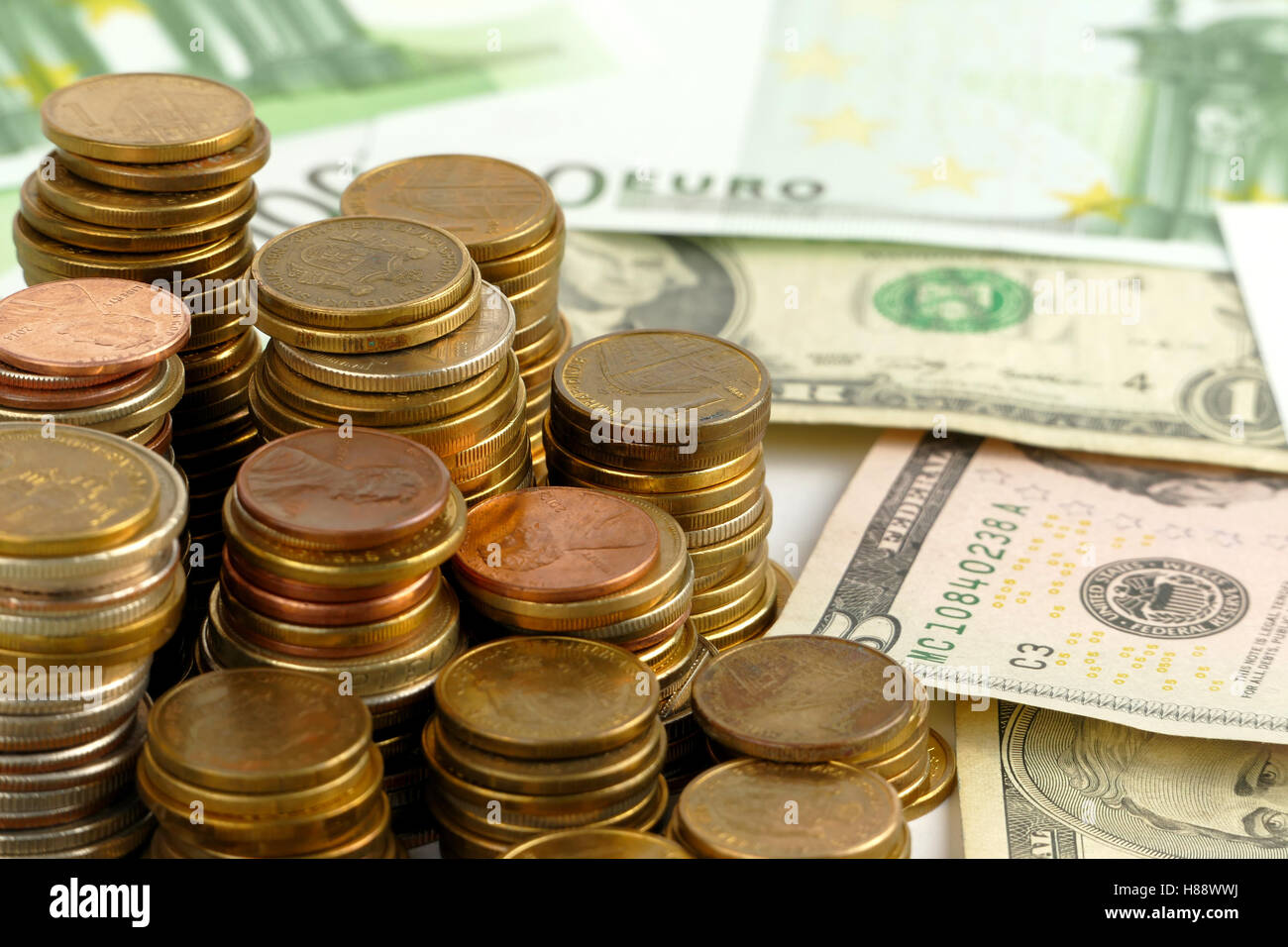 Banknotes and coins isolated on white background Stock Photo - Alamy