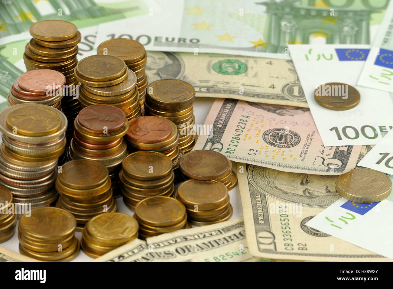 Banknotes and coins isolated on white background Stock Photo - Alamy