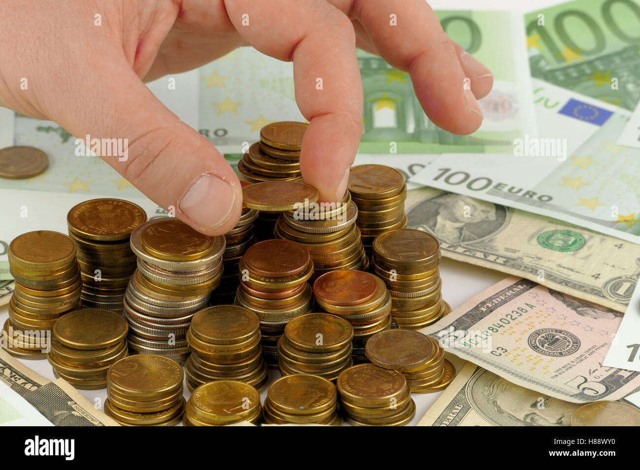 Banknotes and coins isolated on white background Stock Photo - Alamy