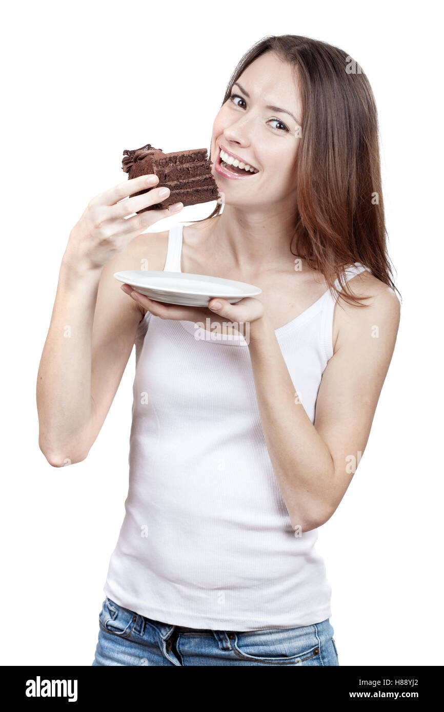 Beautiful young woman eating chocolate cake Stock Photo - Alamy