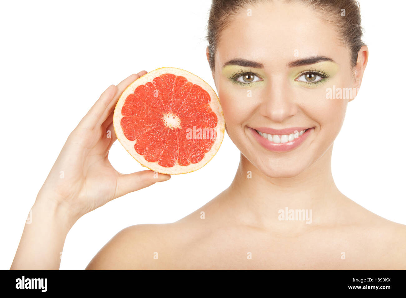 beauty. Young beautiful woman holding grapefruit Stock Photo - Alamy