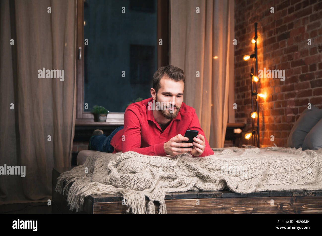 Young man at home Stock Photo - Alamy