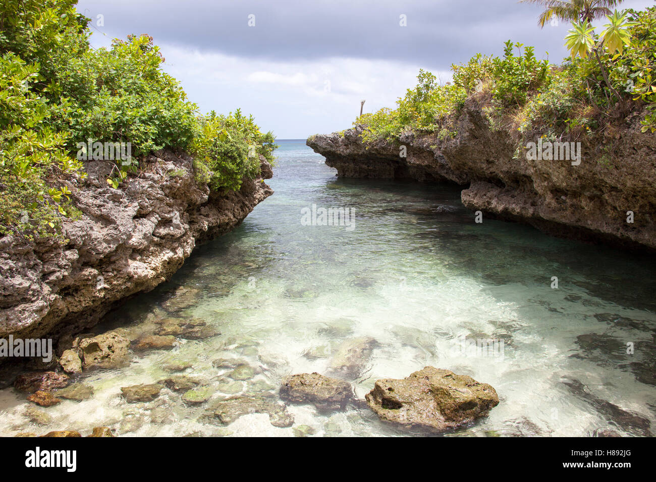 The tiny beach trapped between rocks in Tadine village on Mare island ...