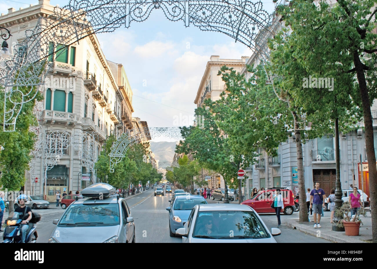 The traffic in street of Roma (Via Roma), one of the main shopping ...