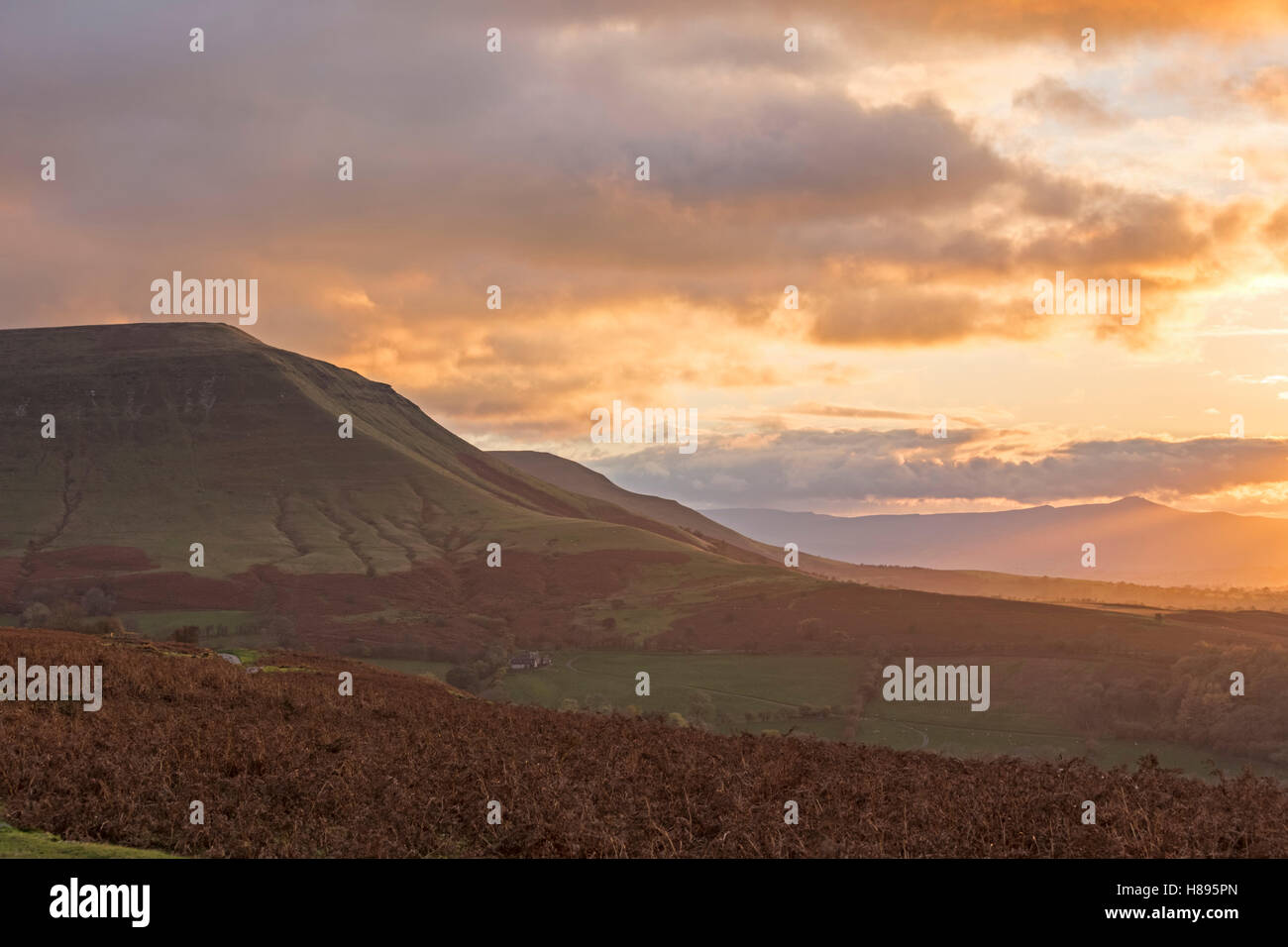 Sunset over Twmpa from the slopes of Hay Bluff and the distant Pen y ...