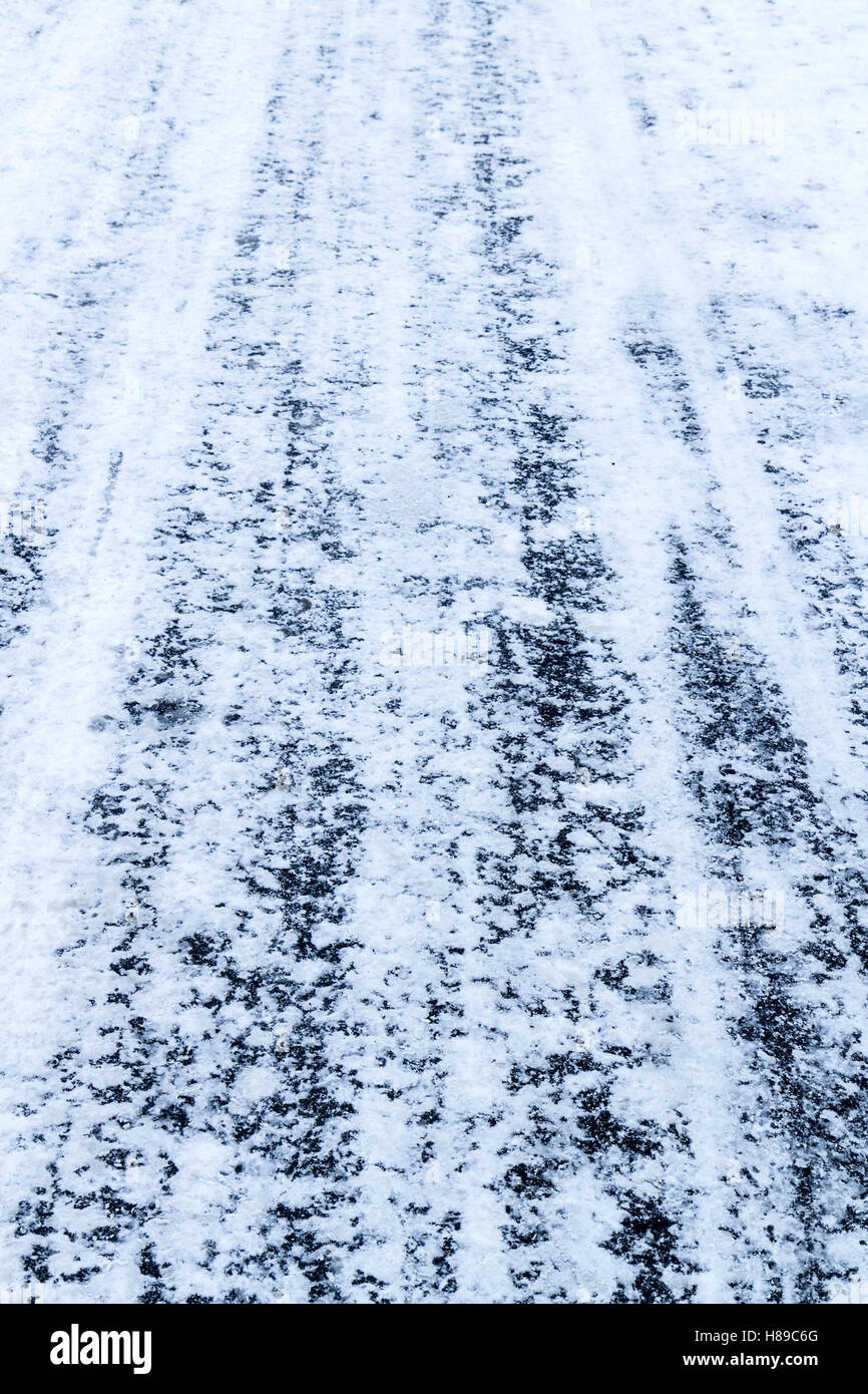 Blue tire tracks in snow Stock Photo - Alamy