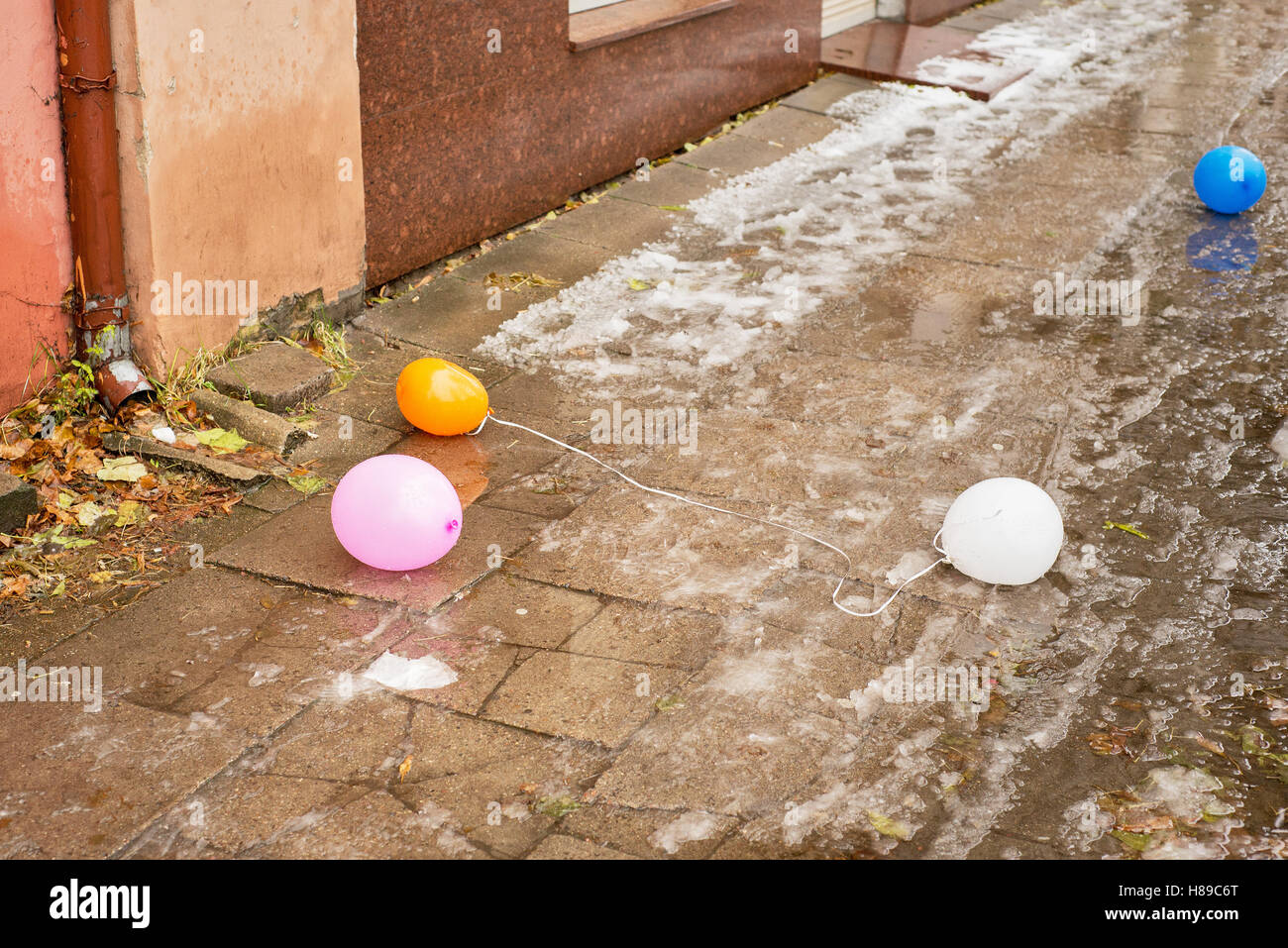 Deflated colorful air balloons Stock Photo - Alamy