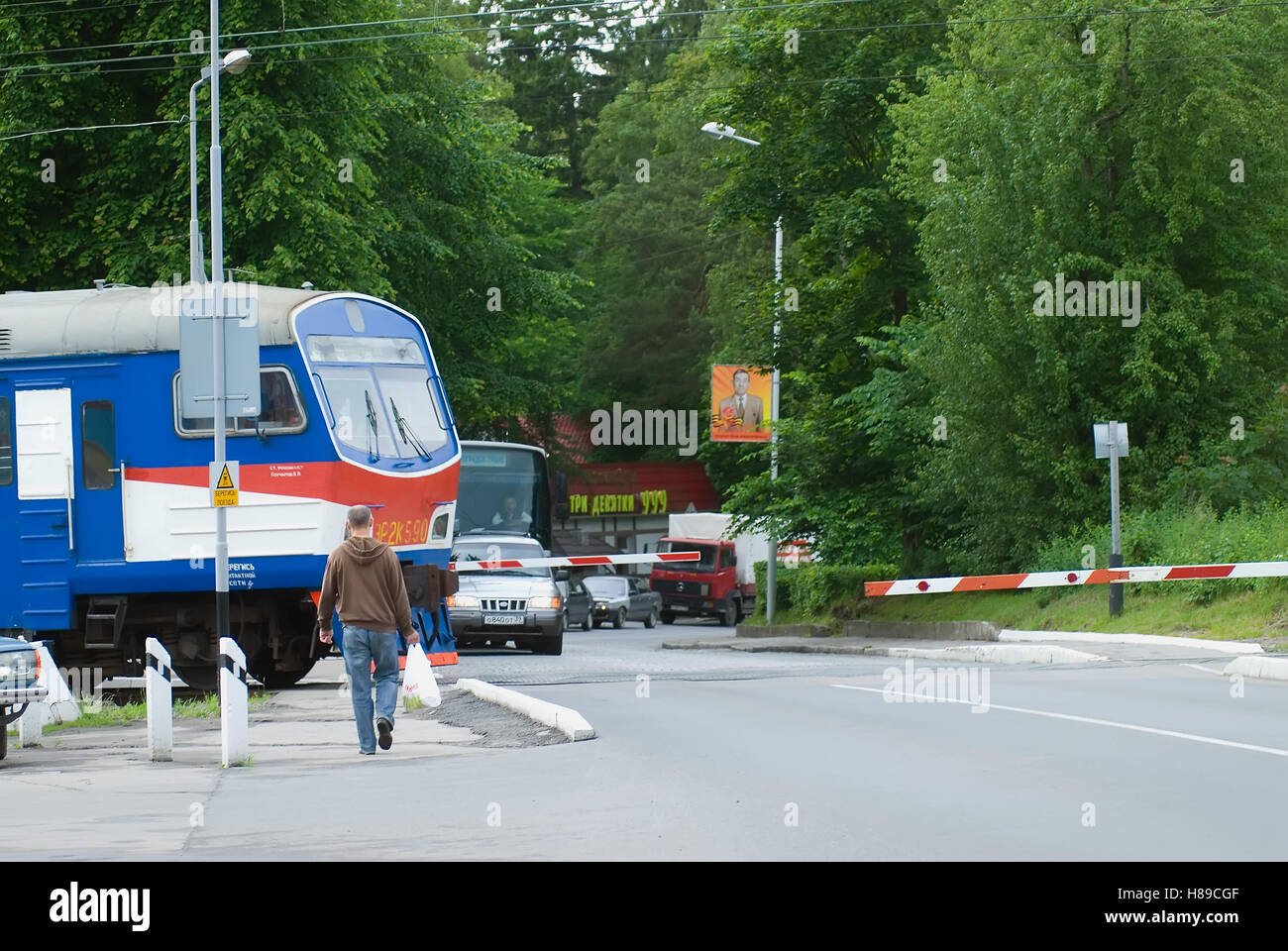 Train riding over a railway crossing in Svetlogorsk. Russia Stock Photo ...