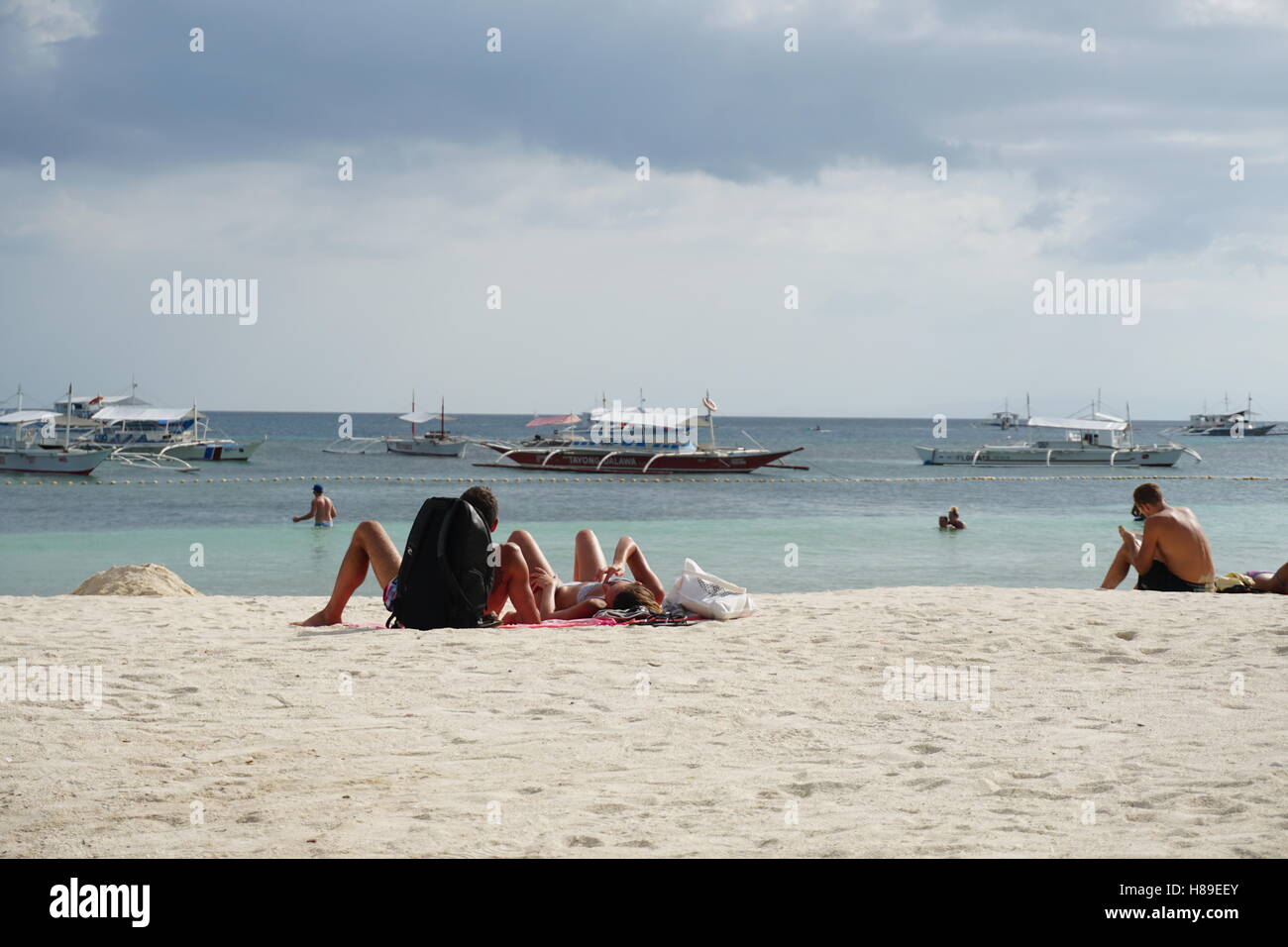 people relaxing on the beach Stock Photo - Alamy