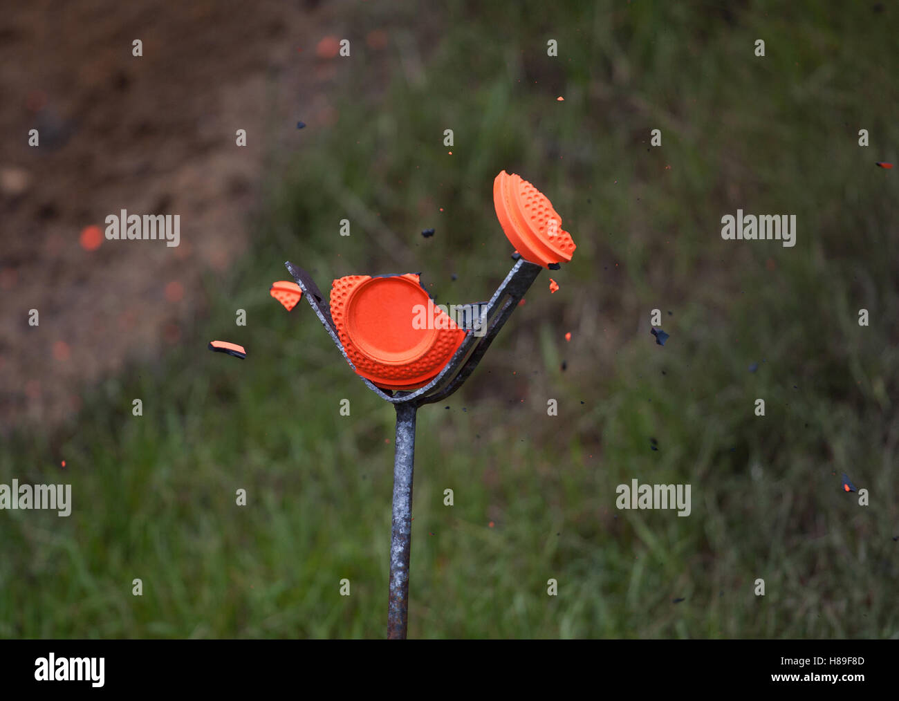 Clay target that has just been hit by a shotgun Stock Photo - Alamy