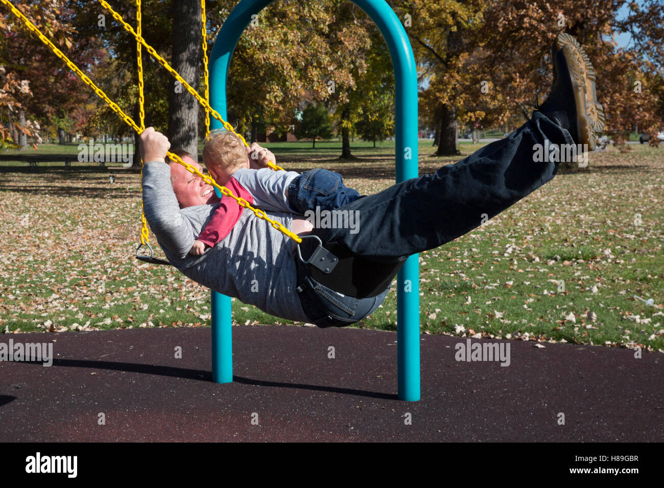 Detroit, Michigan - Adam Hjermstad swings with his two-year-old son ...
