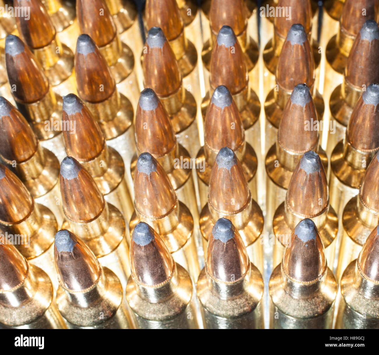 Ammo for a high powered rifle that has light from behind Stock Photo ...
