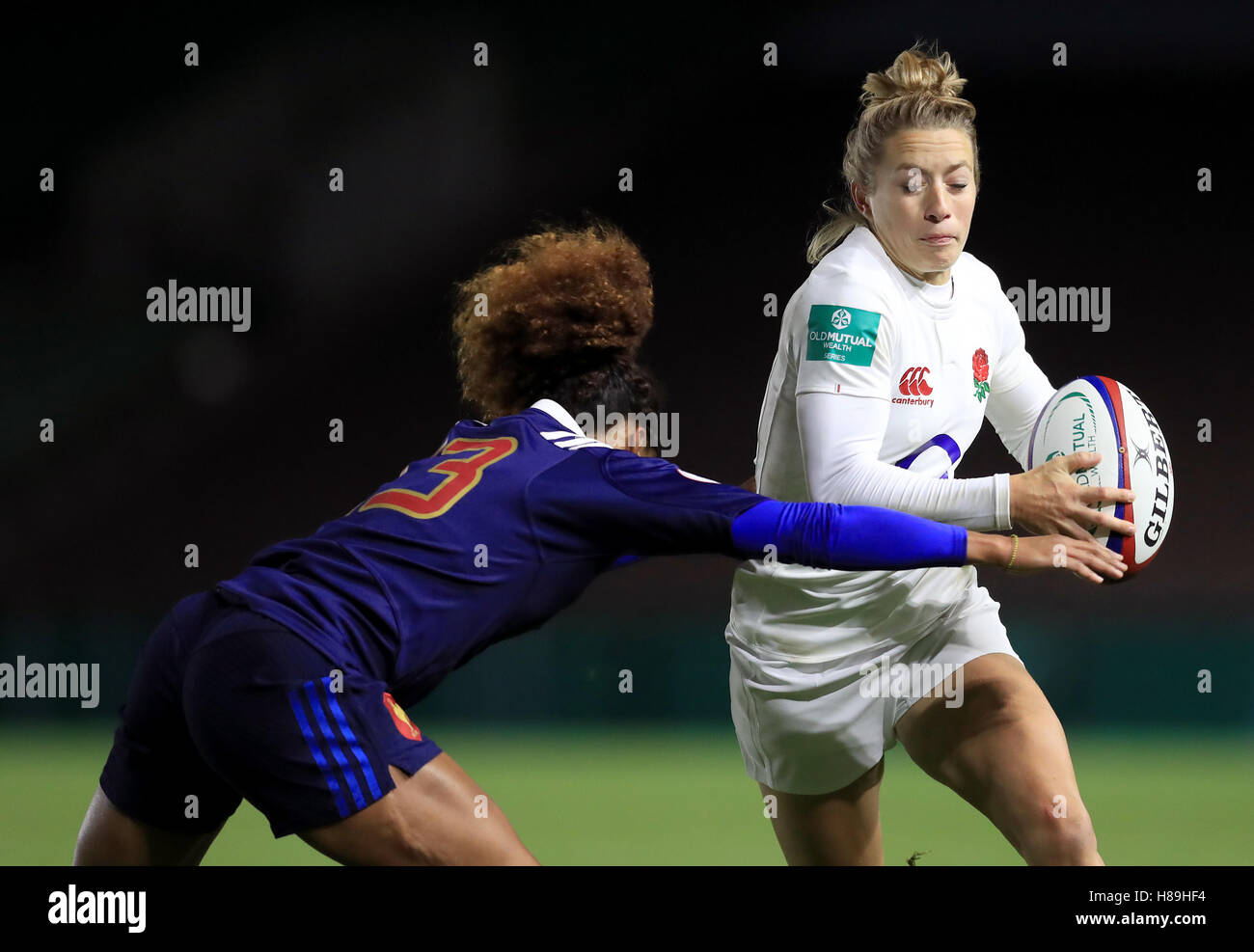 England's Fiona Pocock (right) is tackled by France's Rose Thomas ...