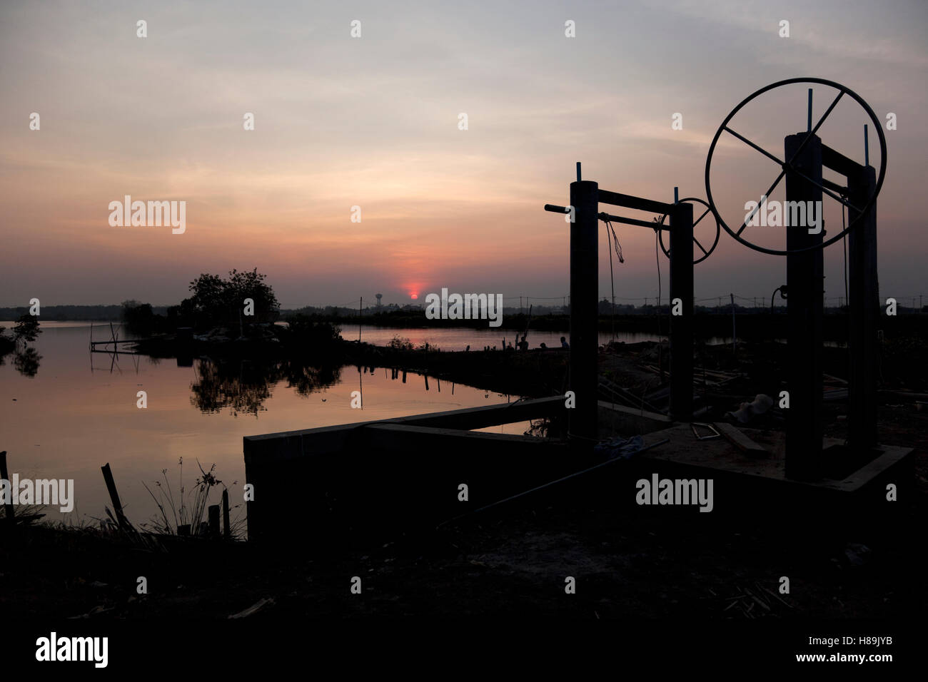 The sluice gate and ponds of a shrimp farm in Samut Prakan in Thailand ...
