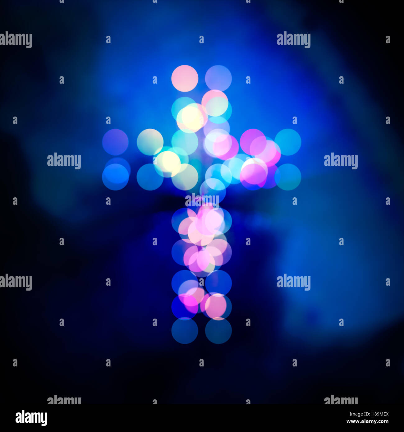 Holy cross blue lights bokeh Stock Photo - Alamy
