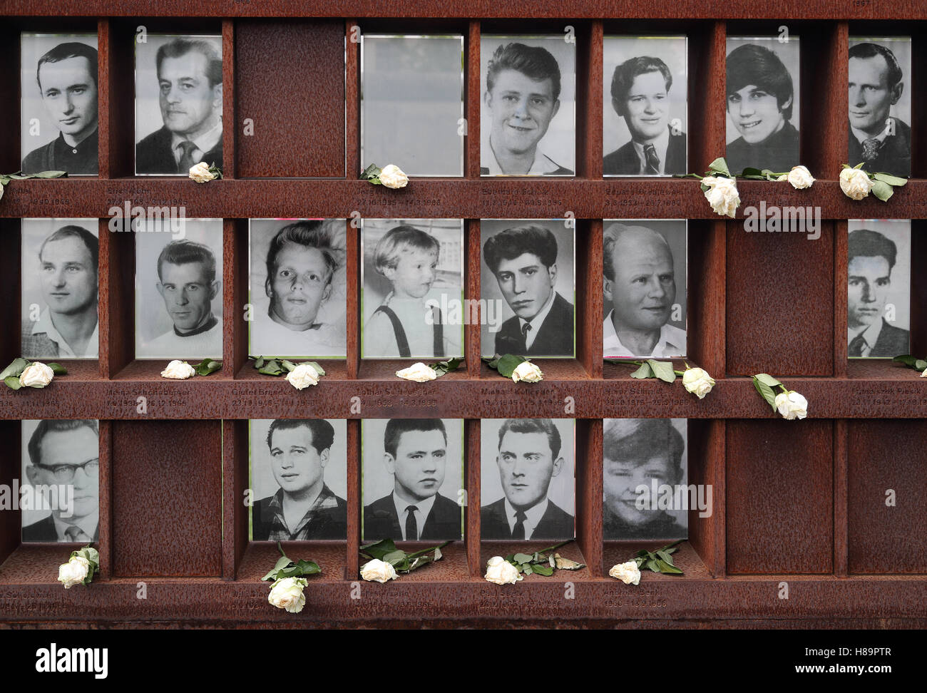 At the Berlin Wall Memorial photos of victims of the Wall are displayed ...