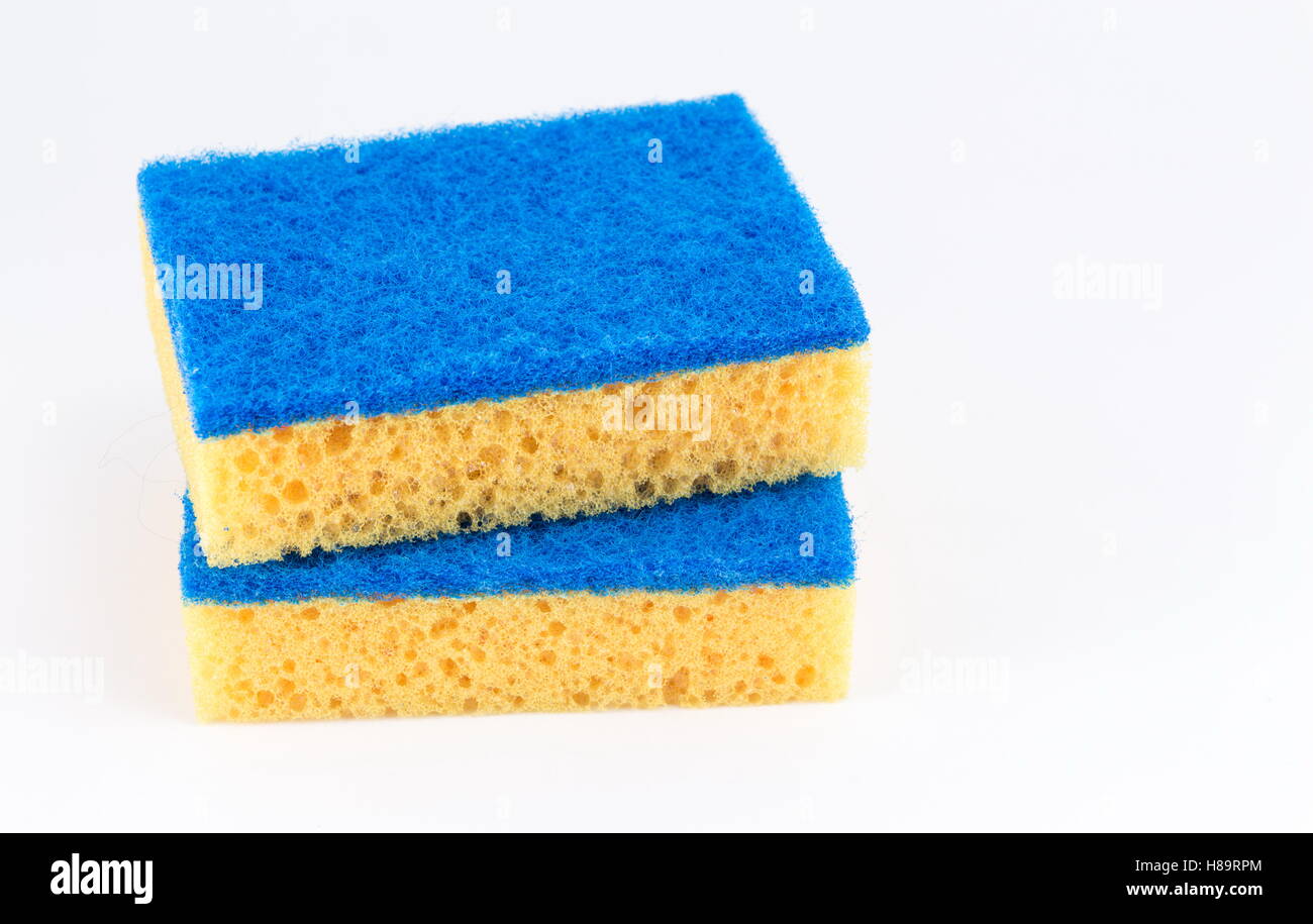 Two sponges for washing dishes on white background Stock Photo - Alamy