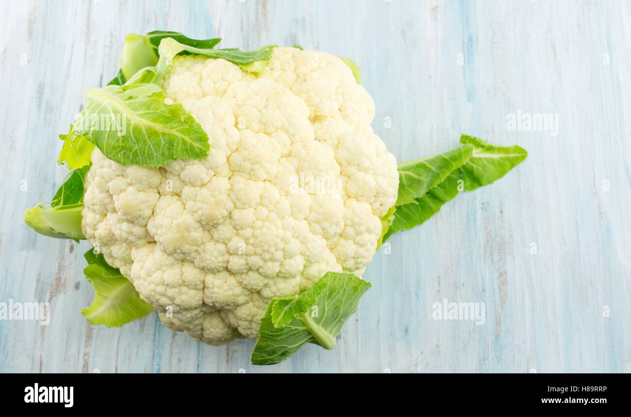 Raw cauliflower on a wooden table. Healthy eating Stock Photo - Alamy
