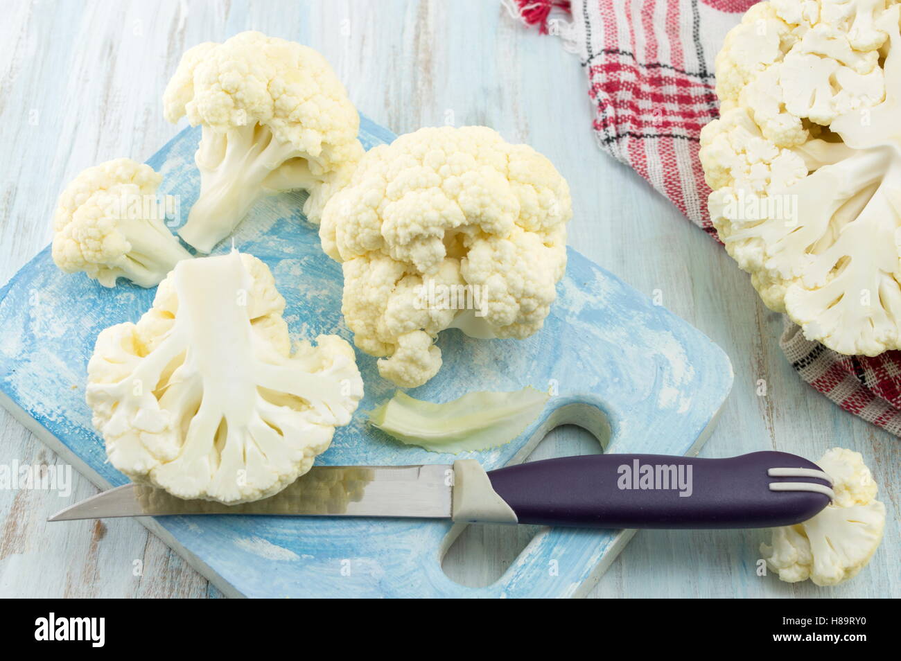 Raw cauliflower sliced on a wooden table. Healthy eating Stock Photo ...