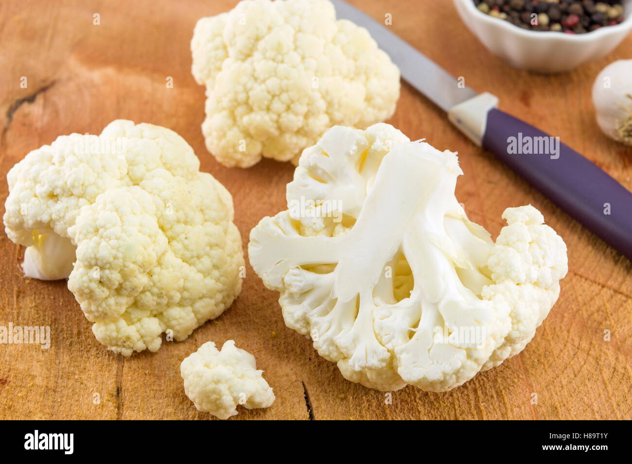 Raw cauliflower sliced on a wooden table. Healthy eating Stock Photo ...