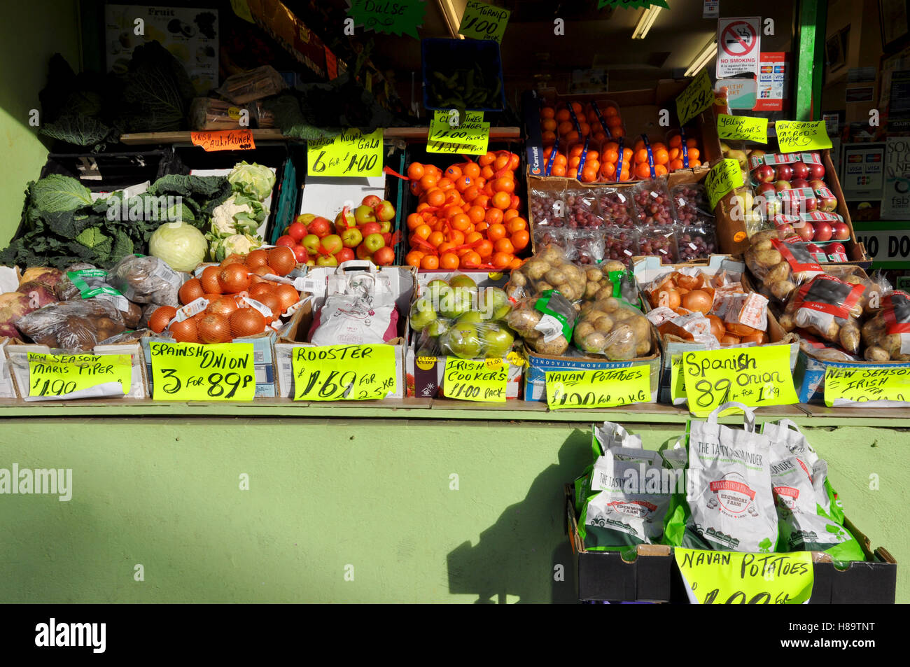 Fruit and vegetables on display outside a greengrocers shop Stock Photo ...