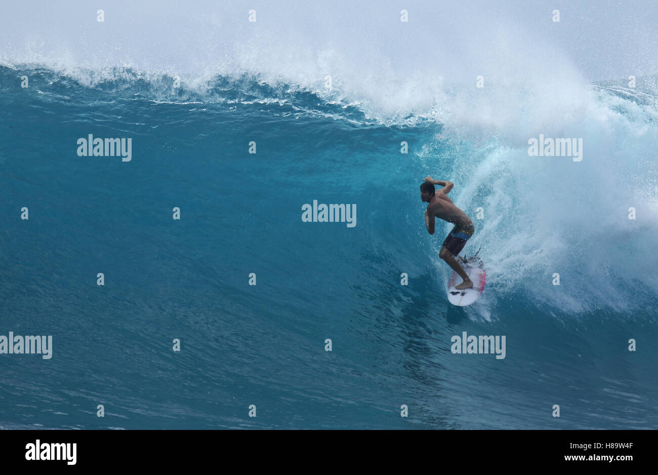 Surfer getting ready to enter a barrel Stock Photo - Alamy