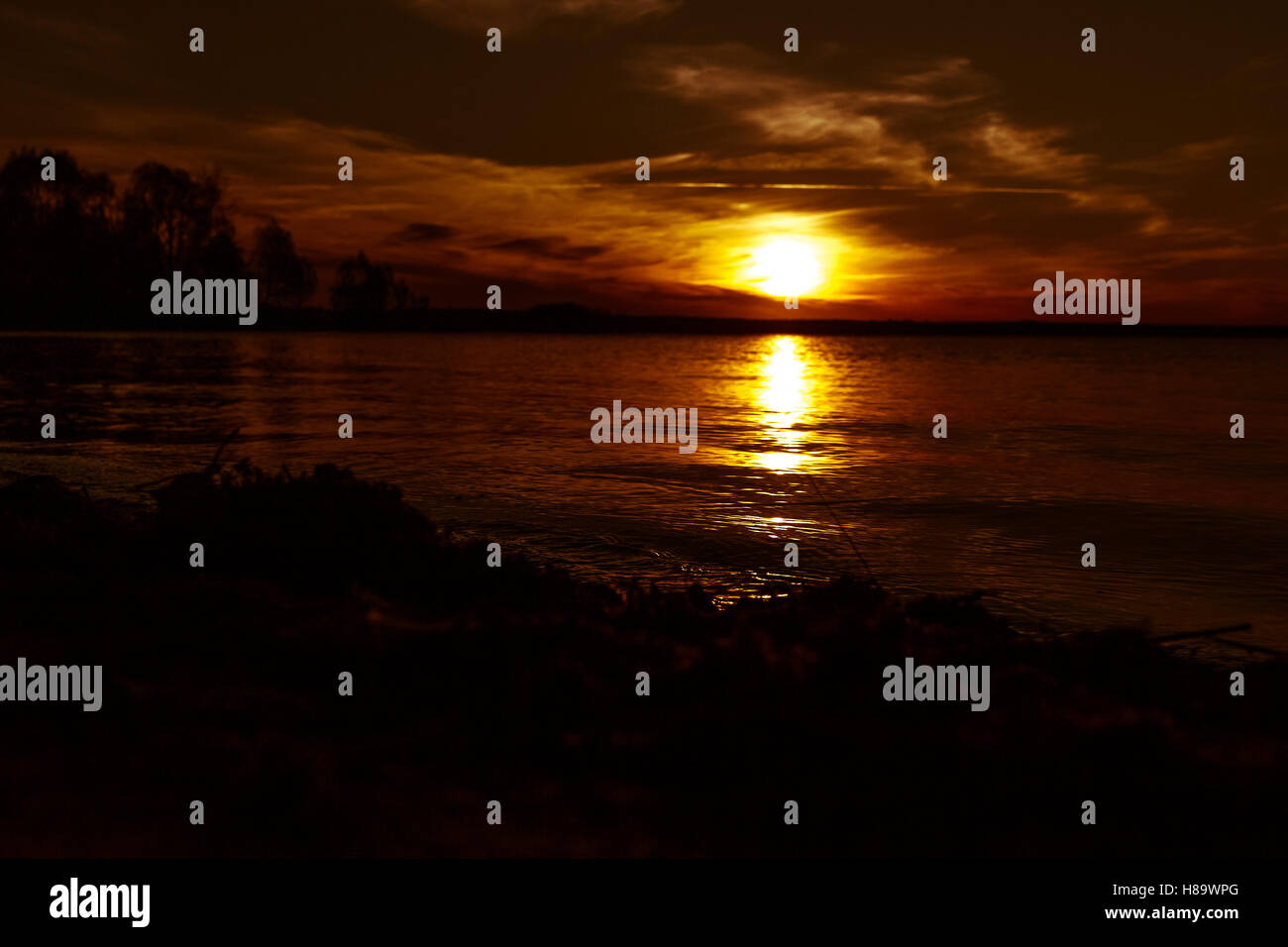 easy wave at sunset Stock Photo - Alamy