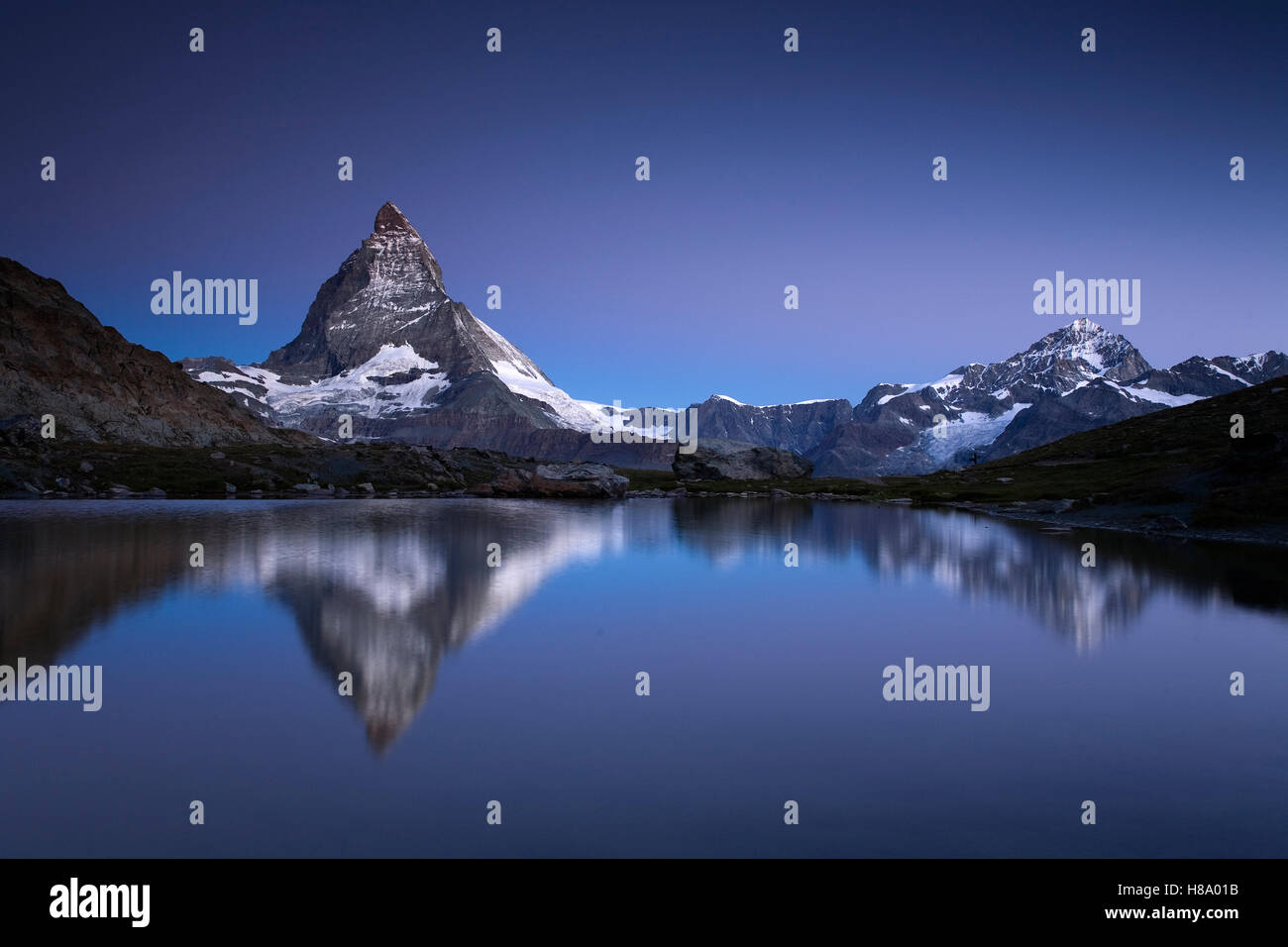 The Matterhorn with reflection in Riffelsee Lake, Alps, Switzerland ...
