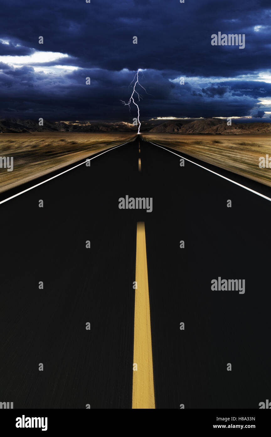 Lightning strike at the end of a road Stock Photo - Alamy