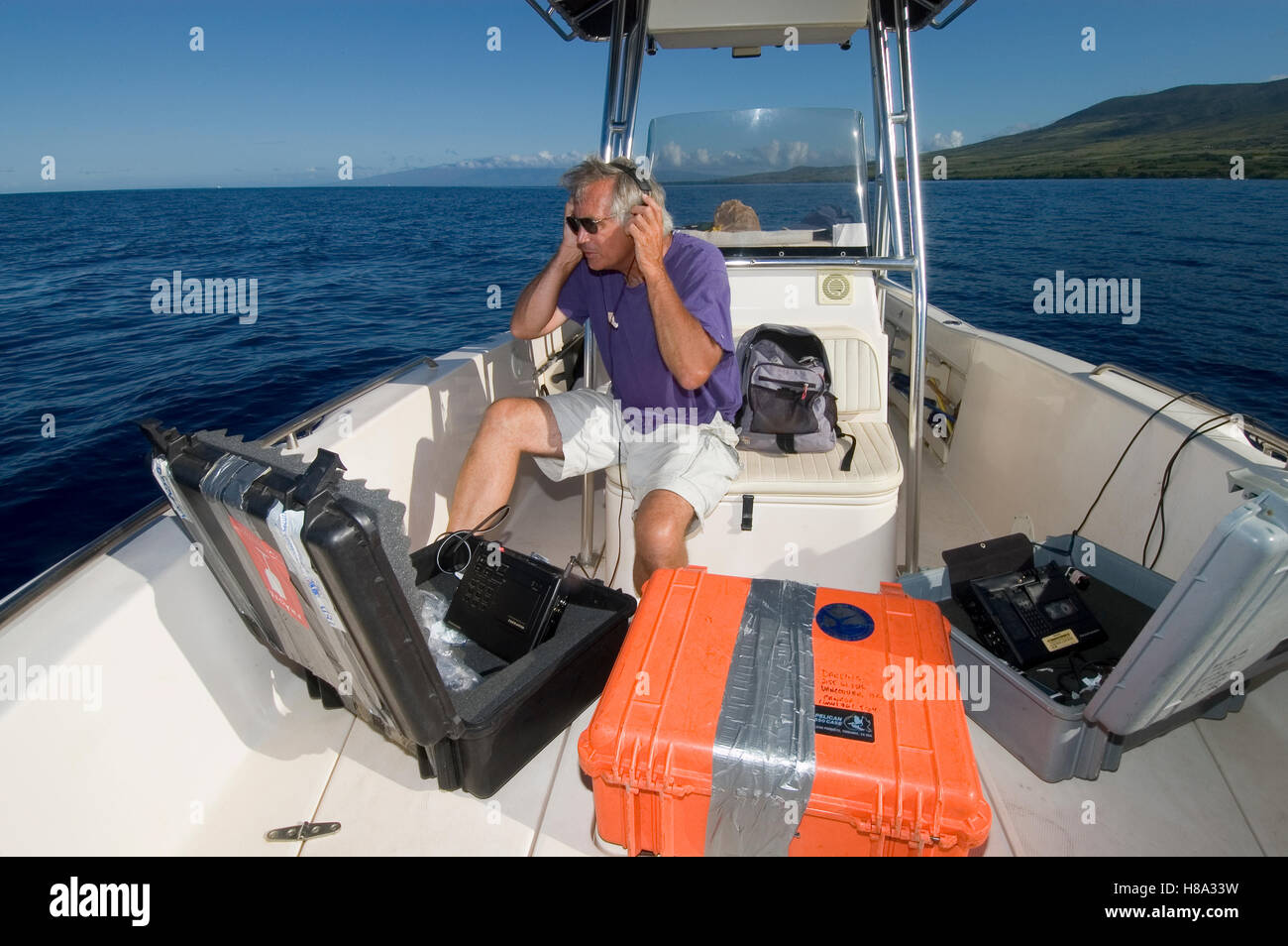 Marine biologist Dr. Jim Darling listening to and recording Humpback ...