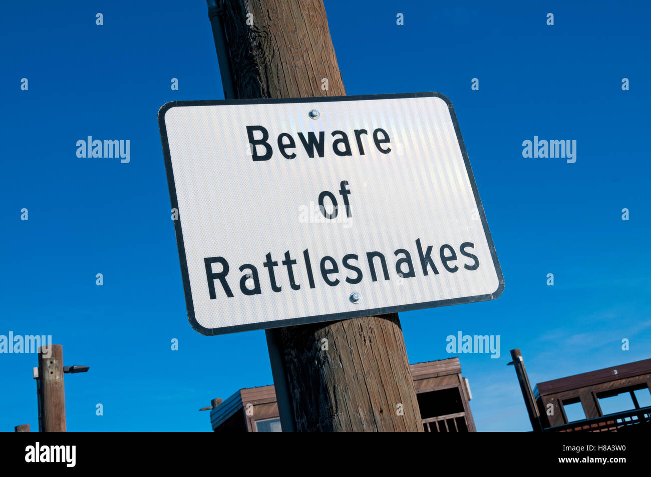 Rattle snake warning sign Stock Photo - Alamy