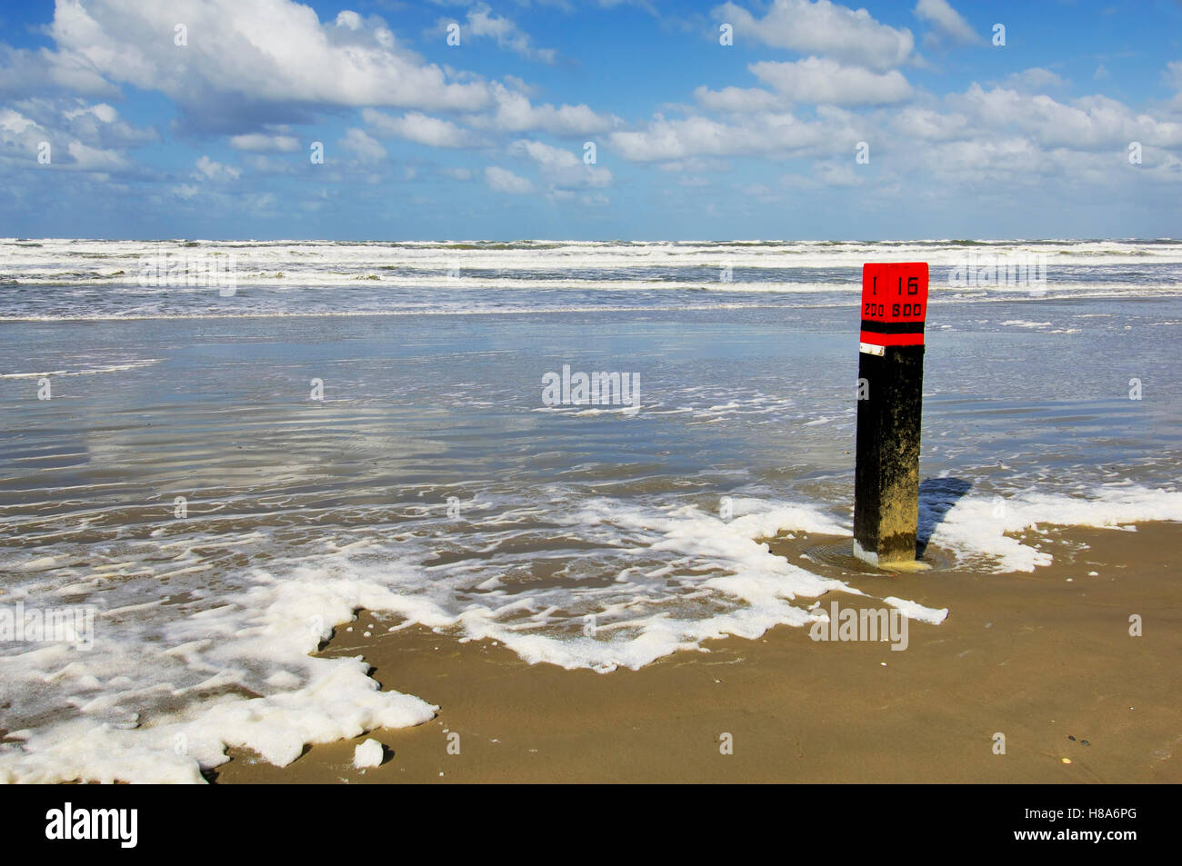 High tide with beach marker, Ameland, Friesland, Netherlands Stock ...