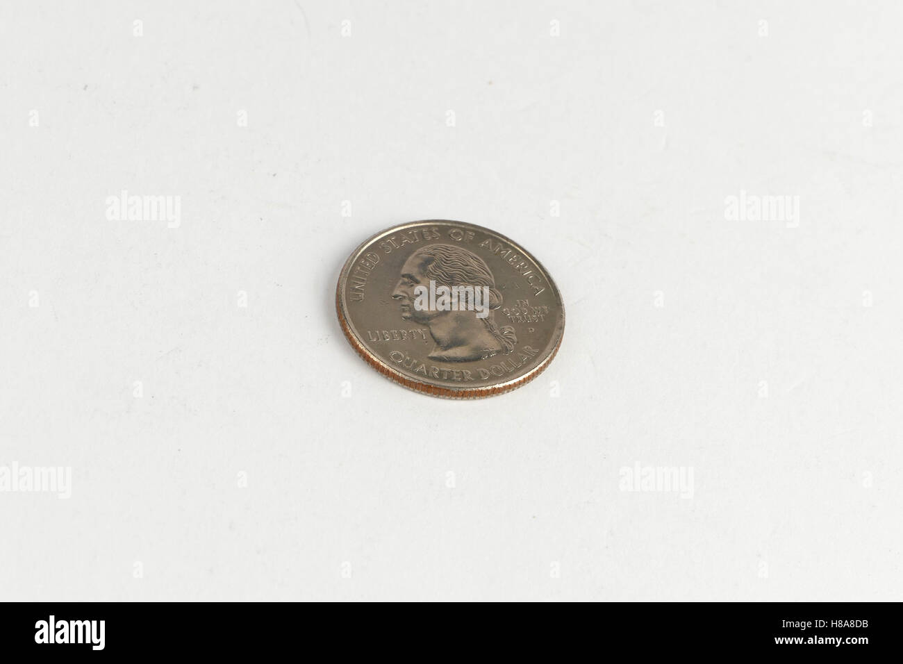 One quarter coin isolated on white background Stock Photo - Alamy