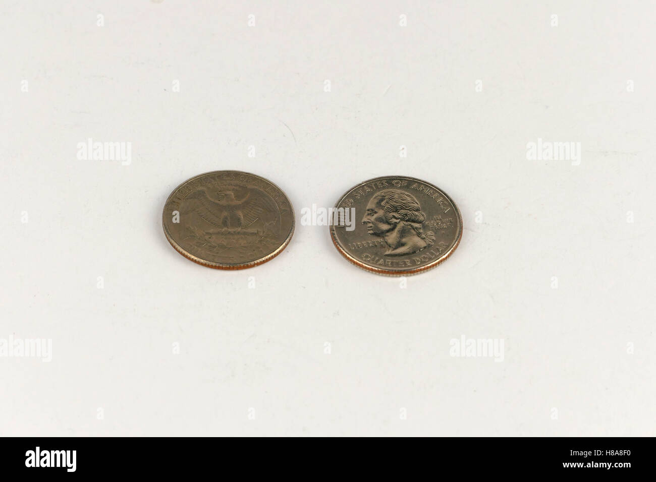 One quarter coin isolated on white background Stock Photo - Alamy