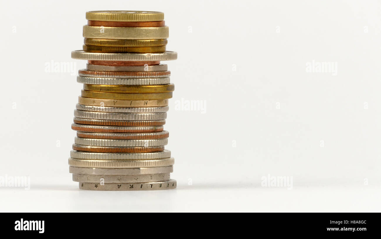 Pile of coins isolated on white background Stock Photo - Alamy