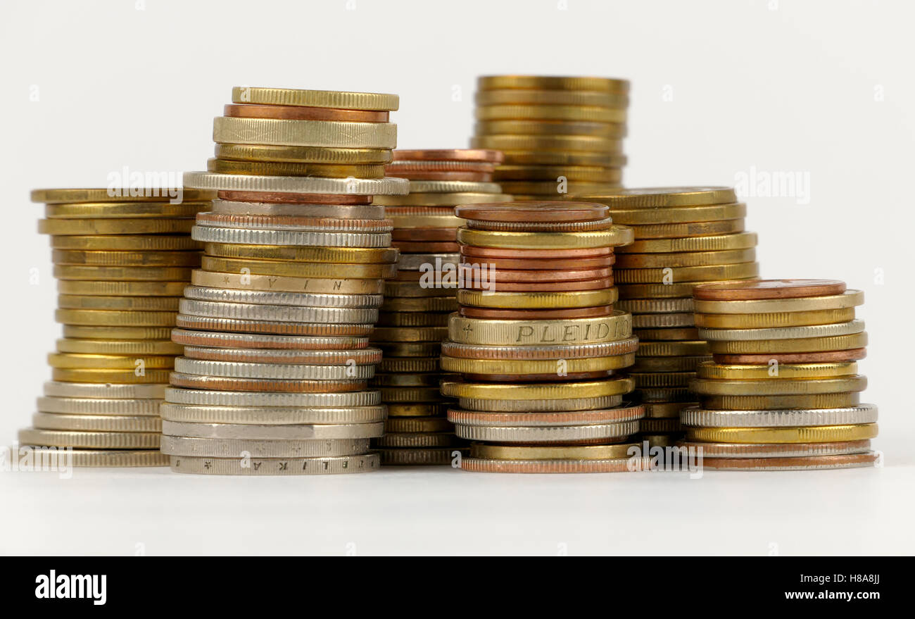 Pile of coins isolated on white background Stock Photo - Alamy