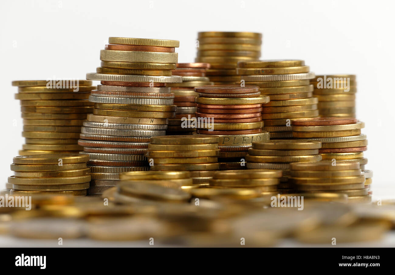 Pile of coins isolated on white background Stock Photo - Alamy