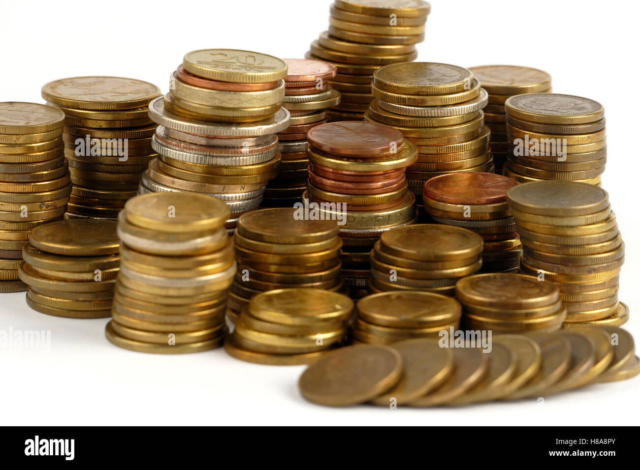 Pile of coins isolated on white background Stock Photo - Alamy
