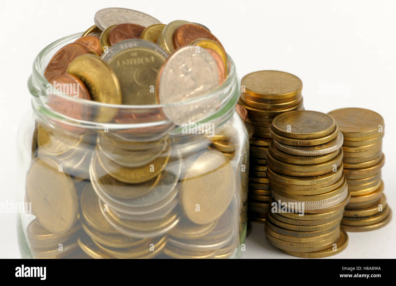 Pile of coins isolated on white background Stock Photo - Alamy