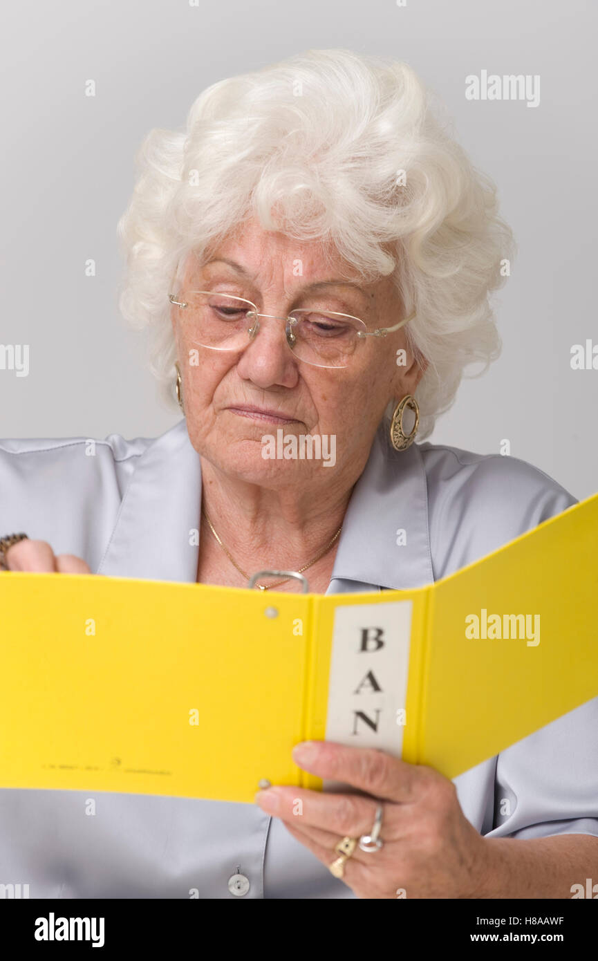 Senior woman with bank statement Stock Photo - Alamy