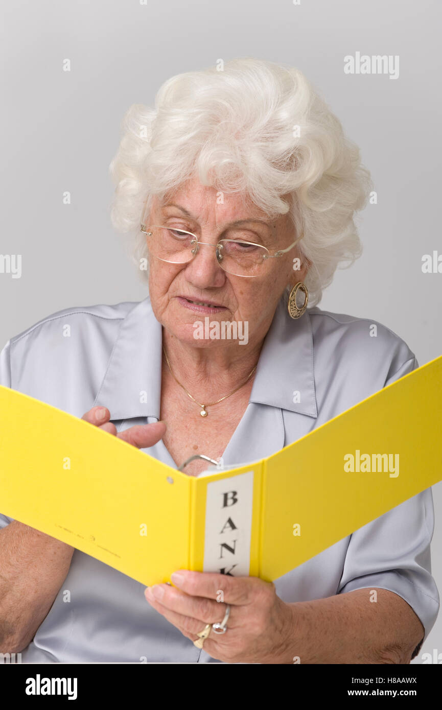 Senior woman with bank statement Stock Photo - Alamy