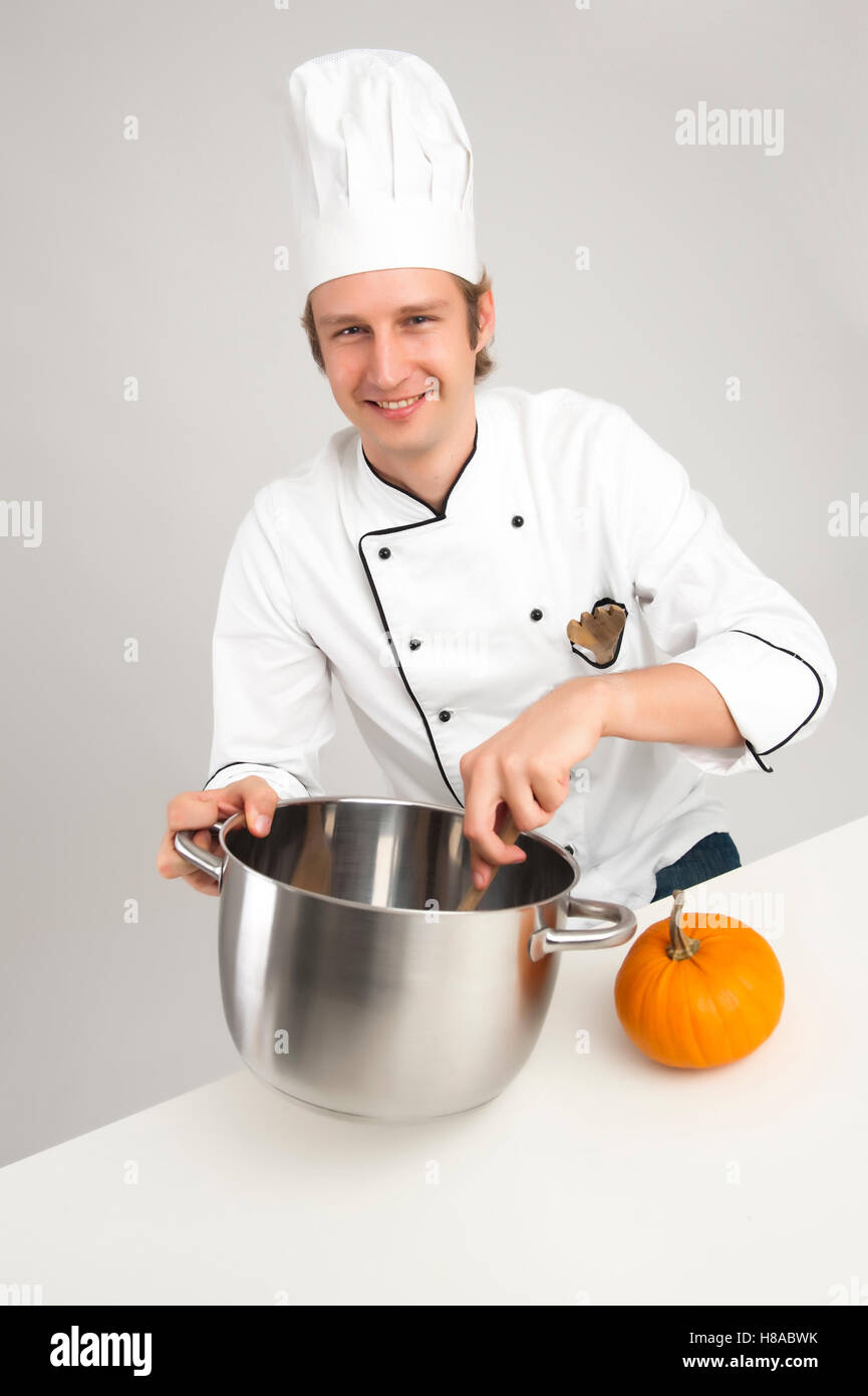 Chef stirring in a pot Stock Photo - Alamy