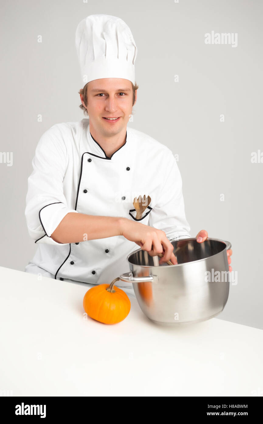 Chef stirring in a pot Stock Photo - Alamy