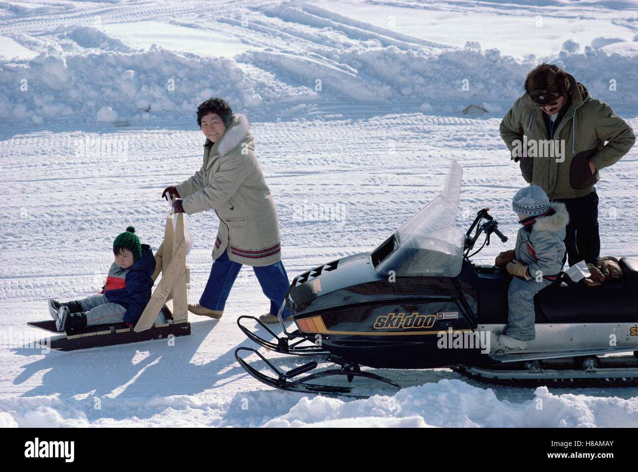 Modern Inuit family with snowmobiles, Ellesmere Island, Nunavut, Canada ...