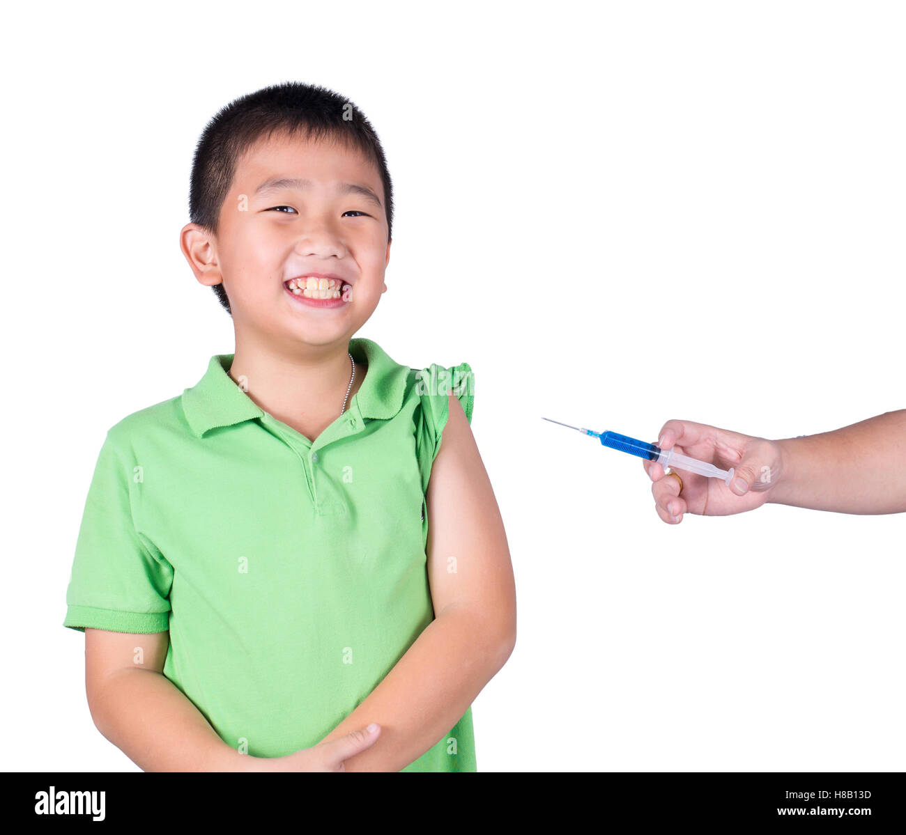 A fearful boy wearing green t-shirt be afraid syringe Stock Photo - Alamy