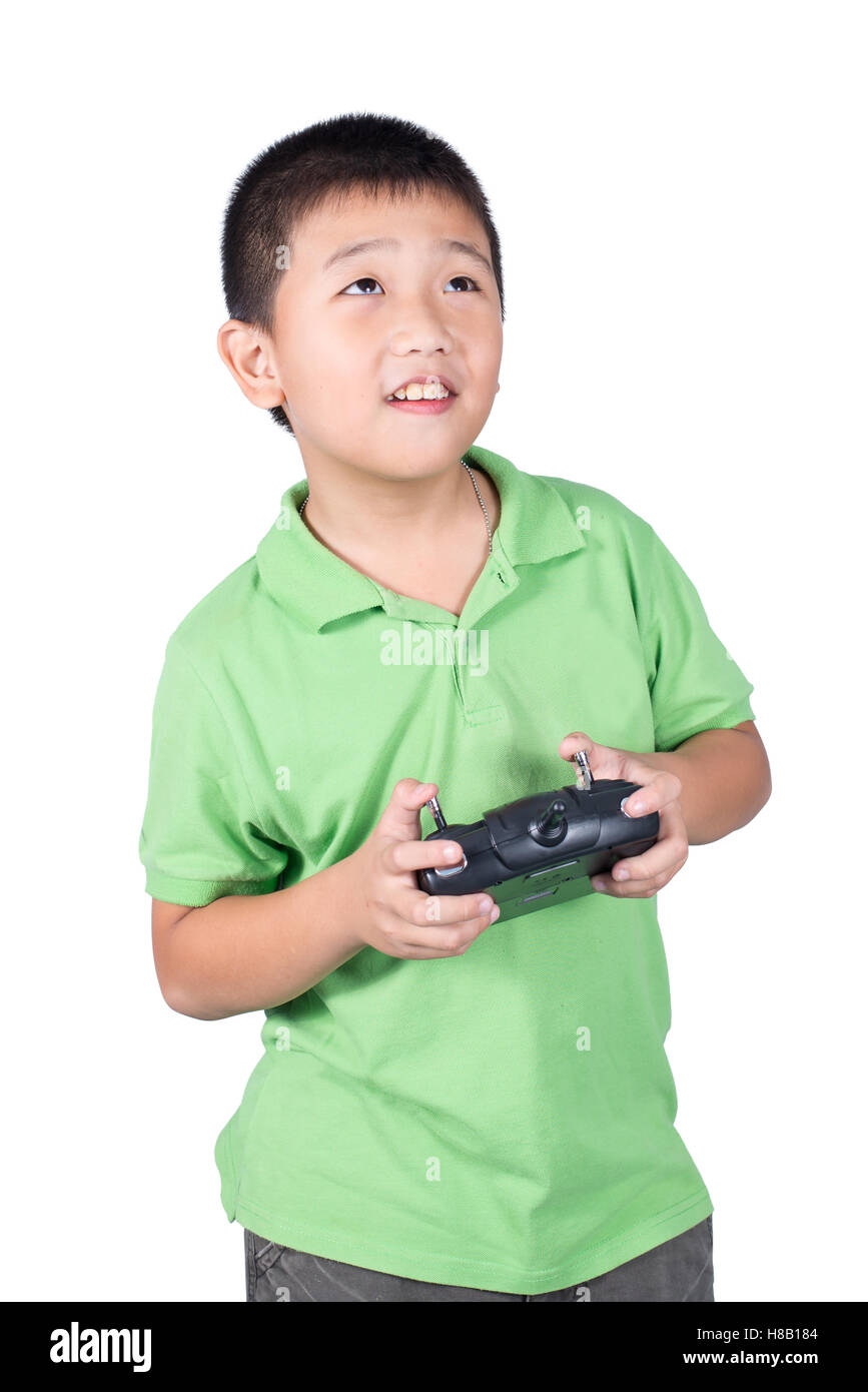 Little boy holding a radio remote control (controlling handset) for ...